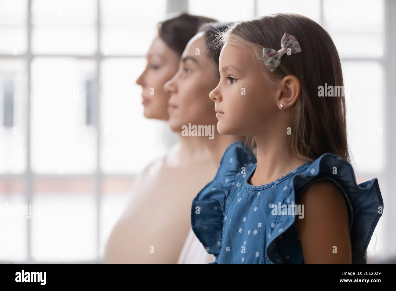 Beautiful three female generations looking at distance Stock Photo - Alamy