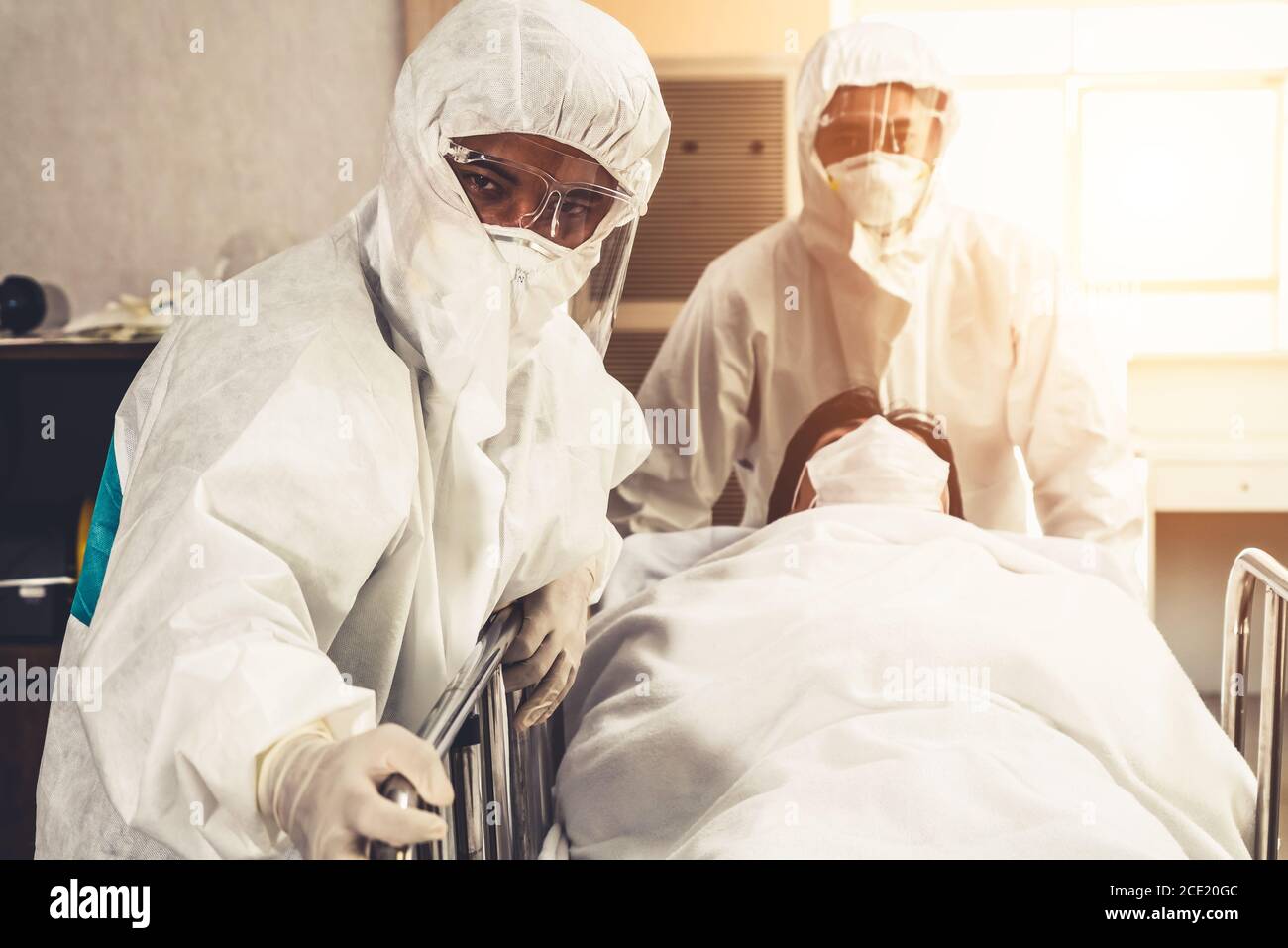 Emergency medic and doctor moving patient to emergency room Stock Photo ...