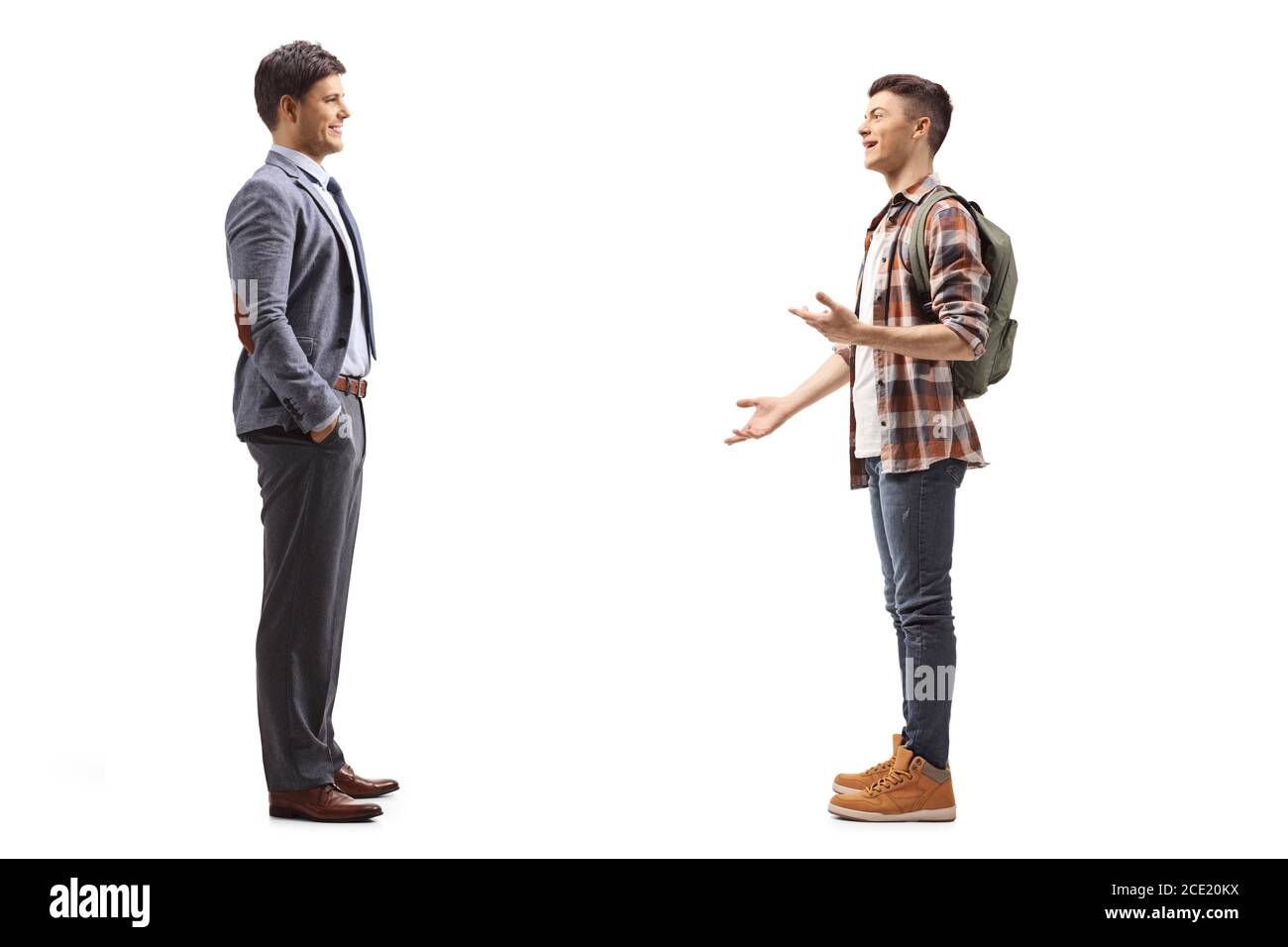 Full length profile shot of a male student talking to a man in a suit ...