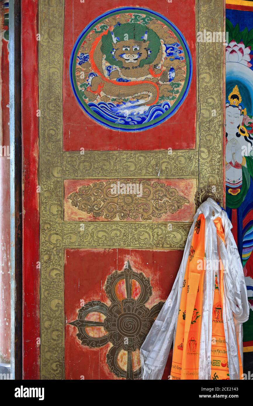 Red wooden door-golden ornate-protector dragon-lotus flower on Buddhist ...