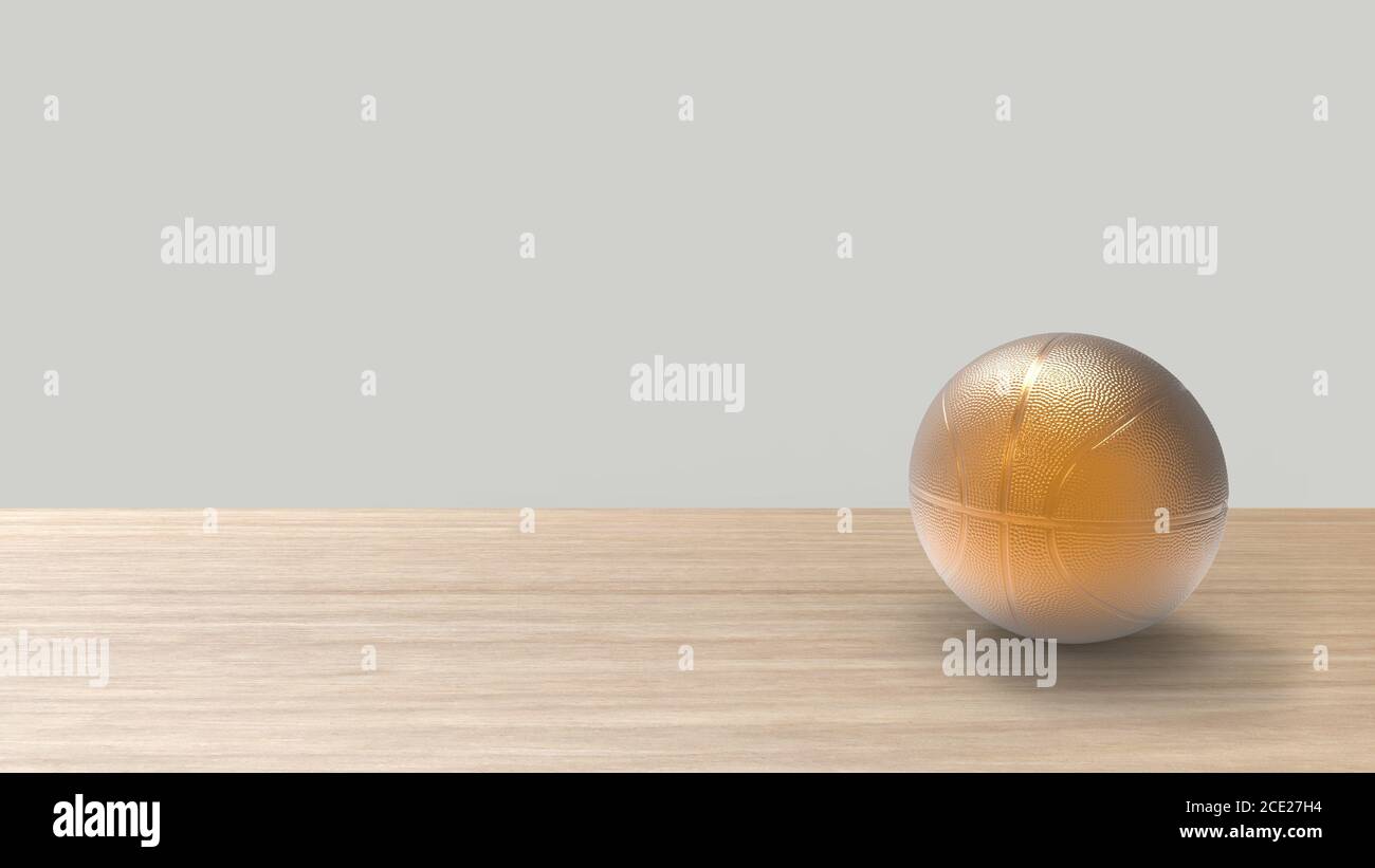 Gold metallic Basketball close-up on on wooden table white studio ...