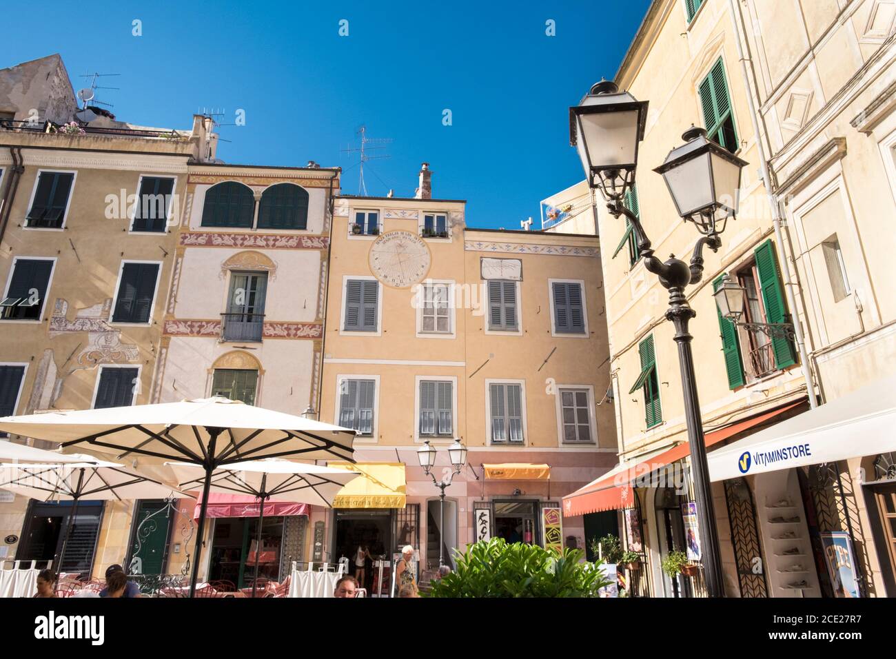 People and old buildings in the old town of Finalborgo, Finale Ligure ...
