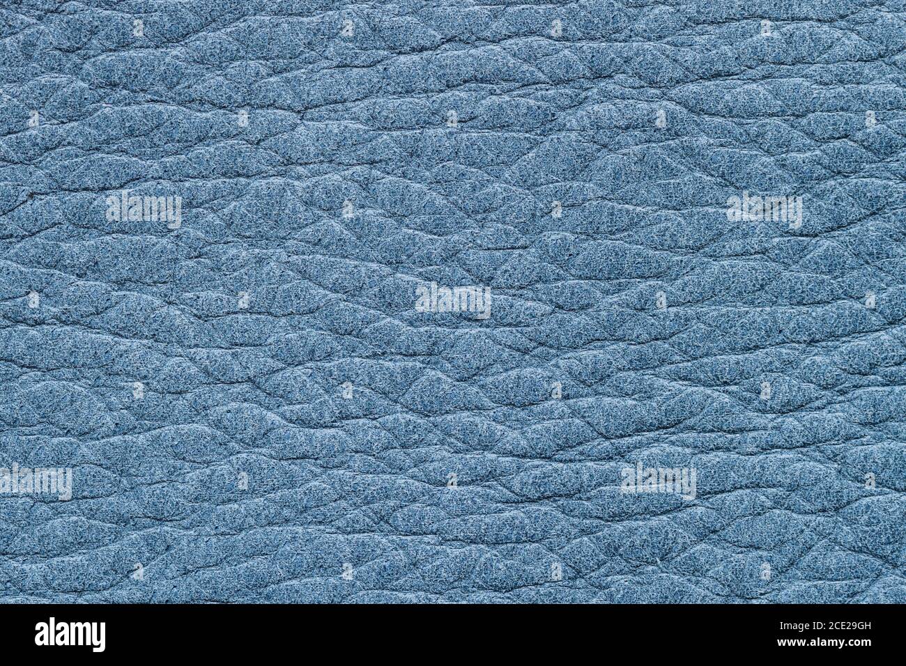 Texture of genuine leather close-up, blue color print. For background ...