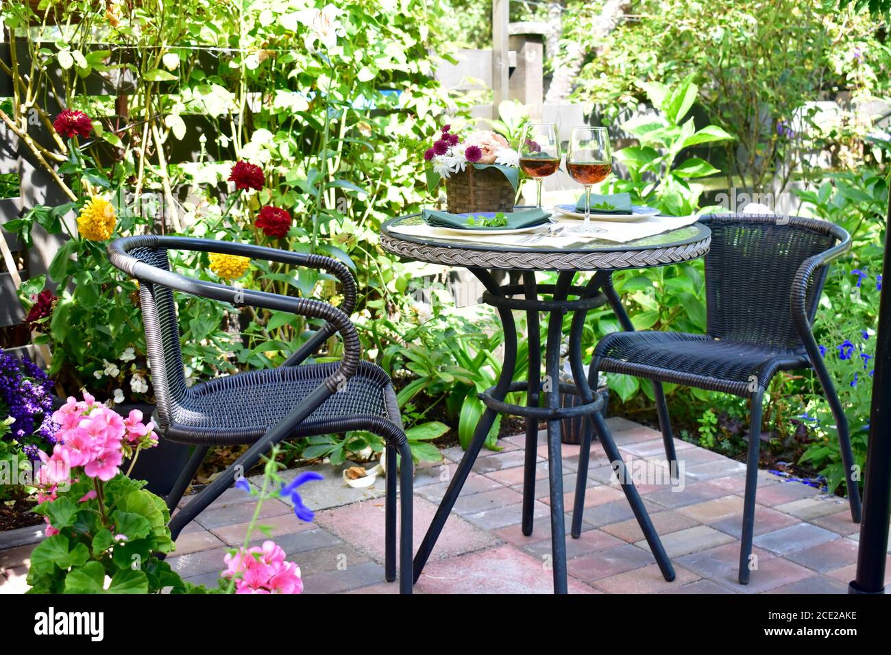 Secluded outdoor patio cafe setting in beautifully landscaped garden on ...