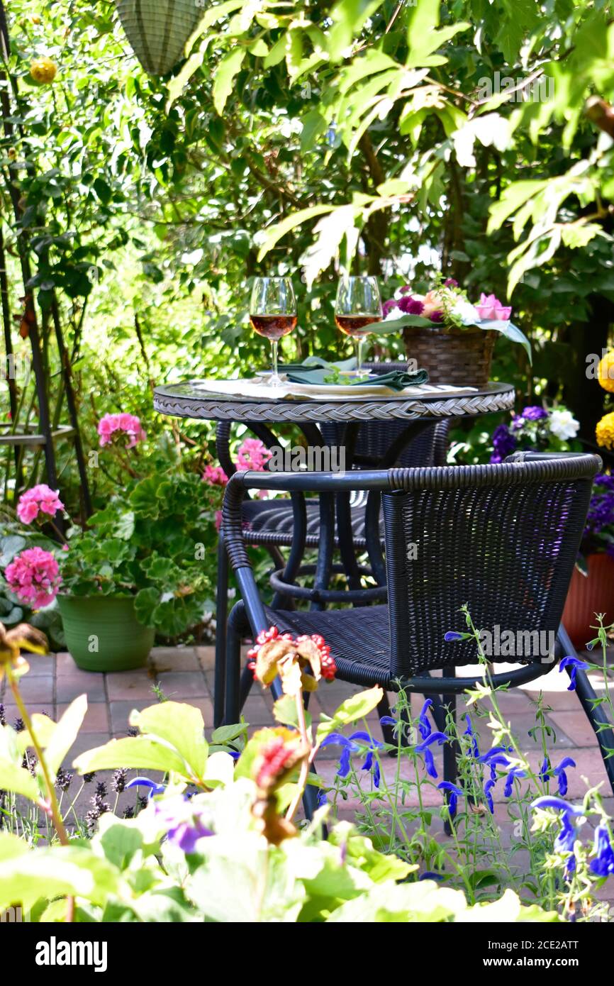 Secluded outdoor patio cafe setting in beautifully landscaped garden on ...