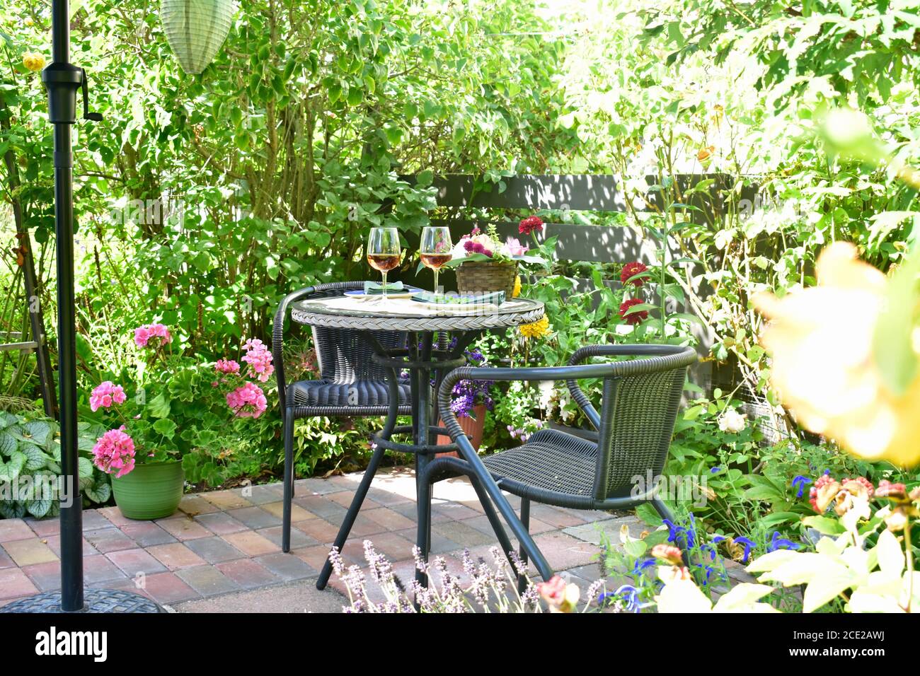 Secluded outdoor patio cafe setting in beautifully landscaped garden on ...