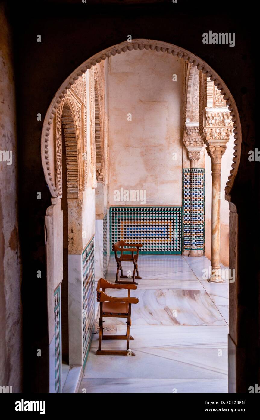 Passing through keyhole arch to the Golden Room at Alhambra in Granada ...