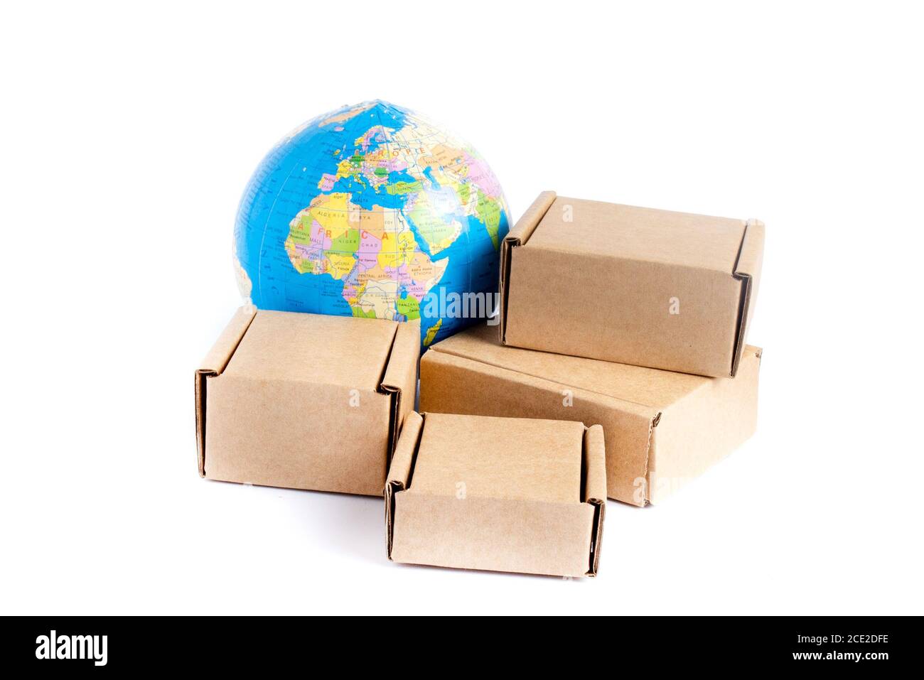 Earth globe is surrounded by boxes isolated on white background. Global ...