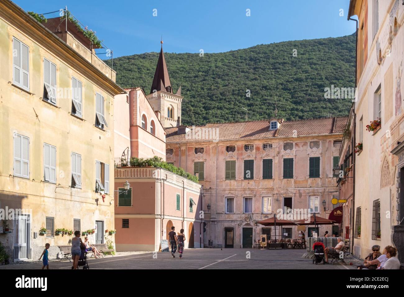 People and old buildings in the old town of Finalborgo, Finale Ligure ...