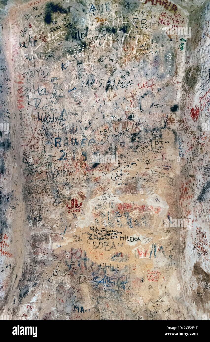 historic wall covered with lots of graffiti tags Stock Photo - Alamy