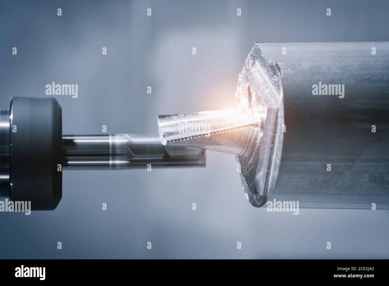 The Hi-precision CNC milling machine with cutting sample in blue-silver ...