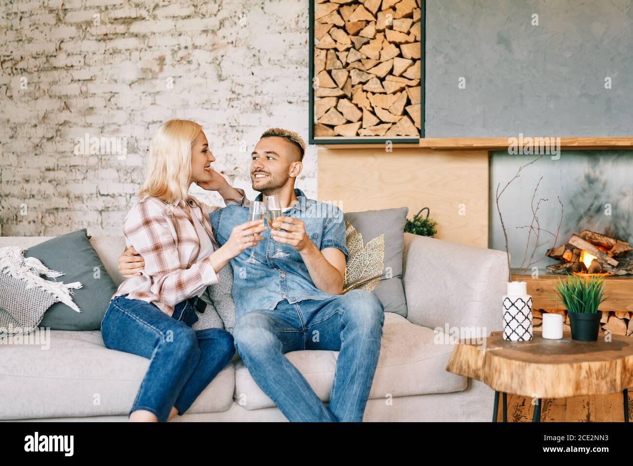 Couple flirting on sofa hi-res stock photography and images - Alamy