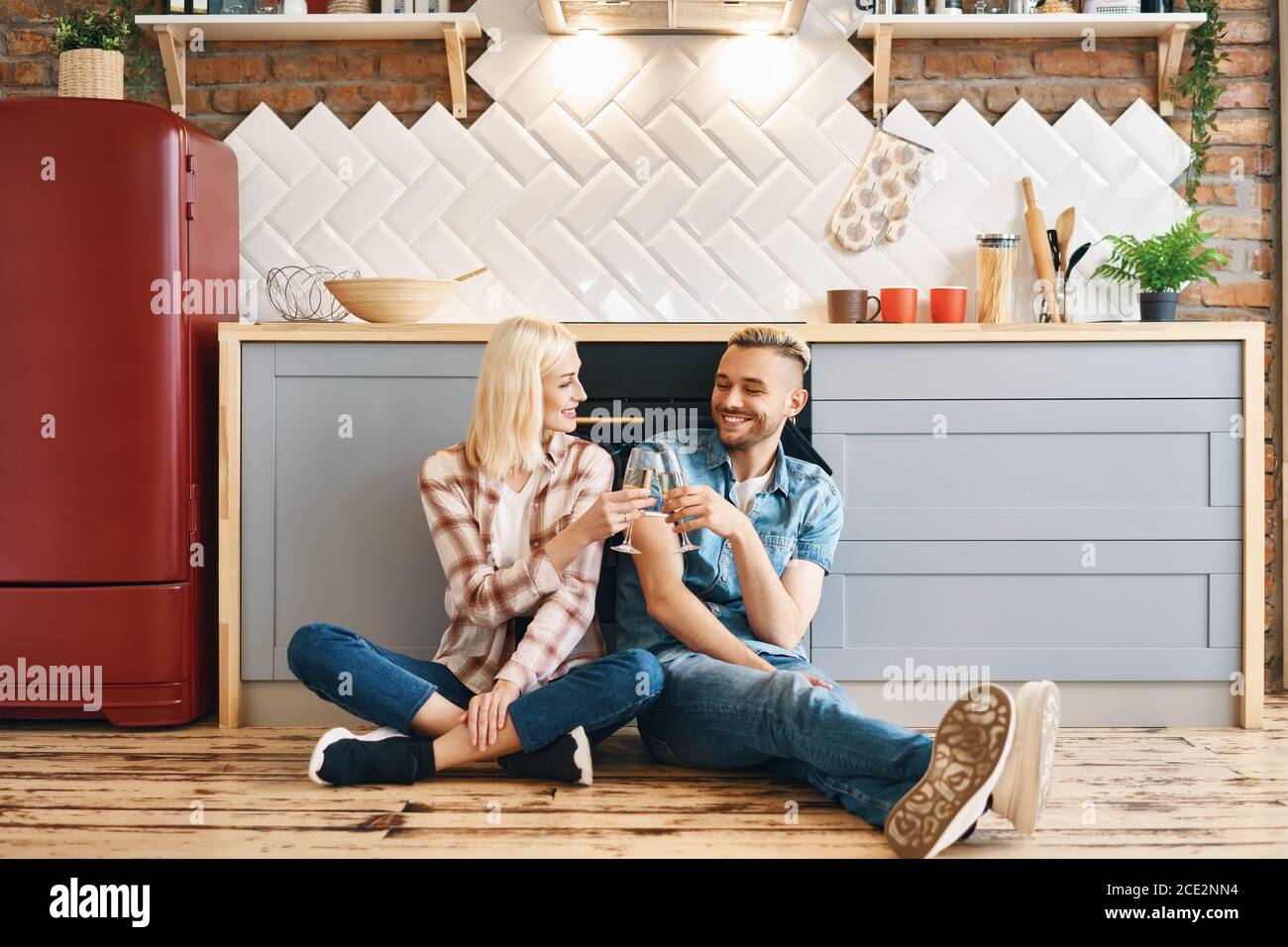 Romantic couple in kitchen hi-res stock photography and images - Alamy