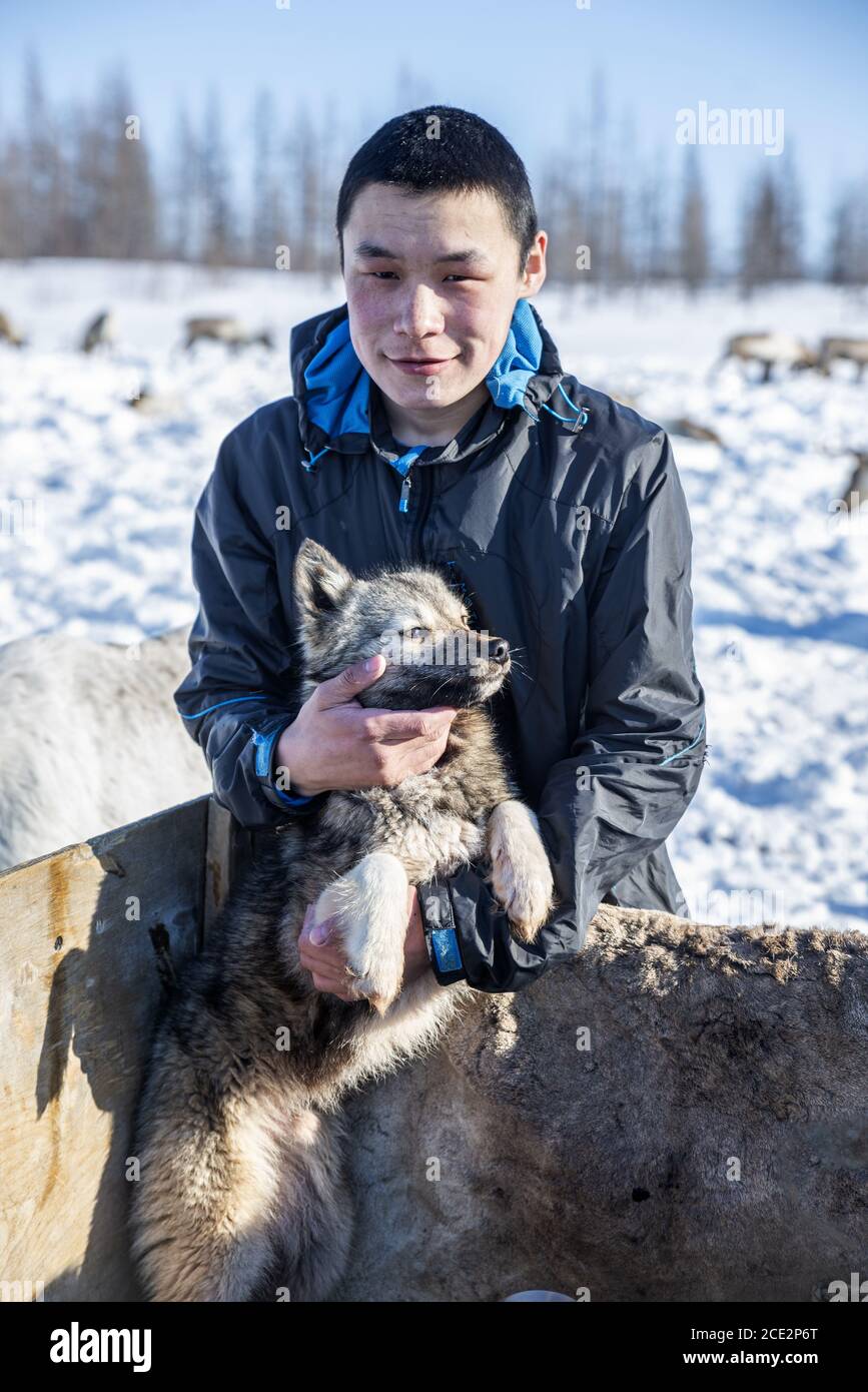 A Nenet boy with his samoyed dog, Yamalo-Nenets Autonomous Okrug ...