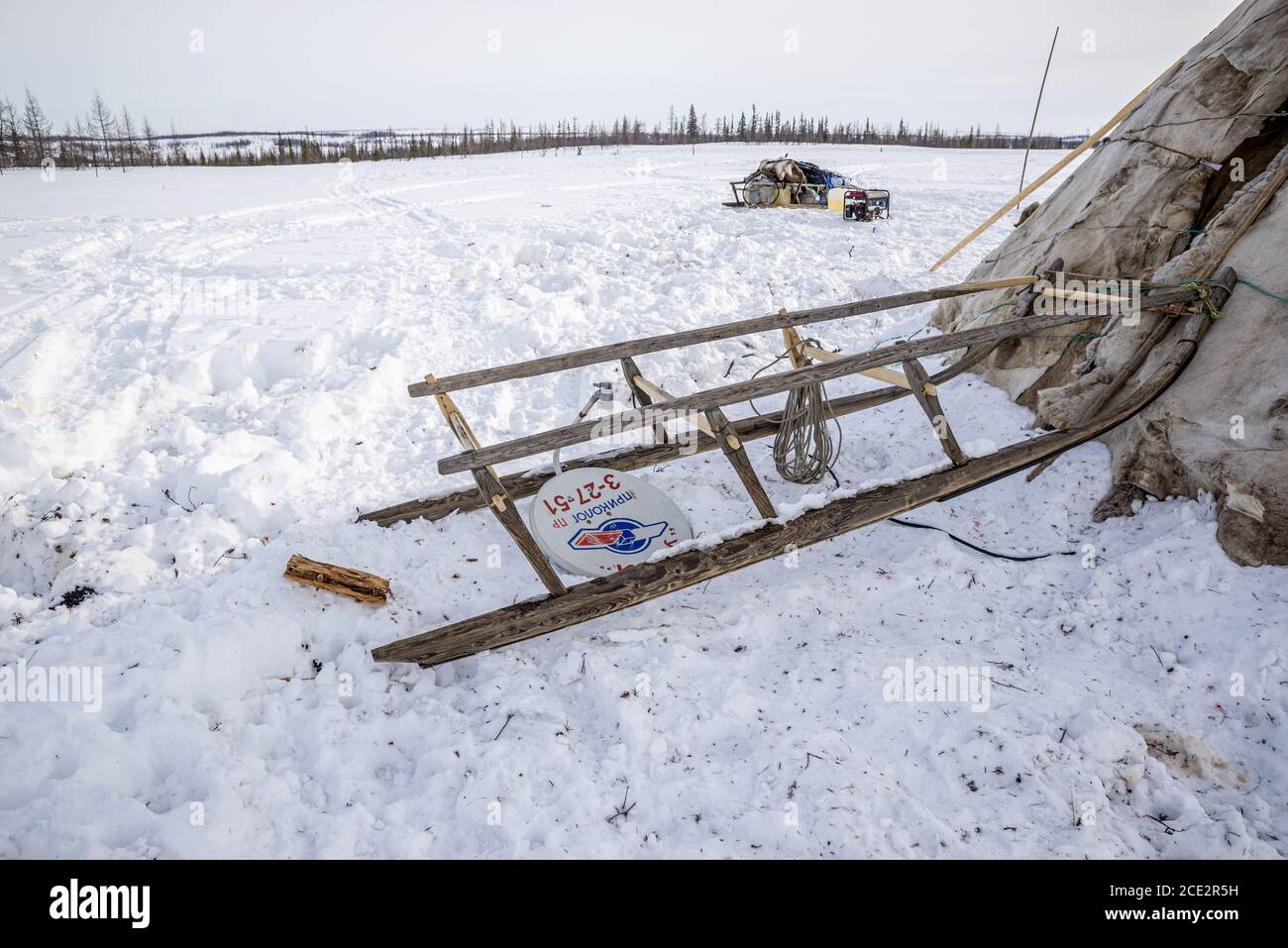 A "sacred sled" on the rear part of a chum (traditional tent covered ...