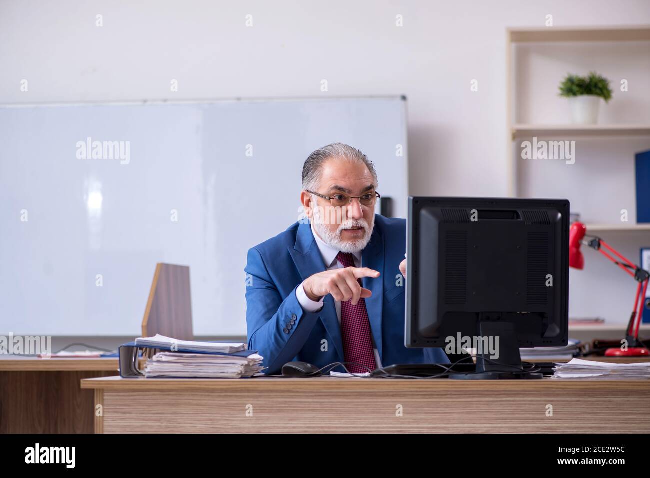 Male boss employee working in the office Stock Photo - Alamy
