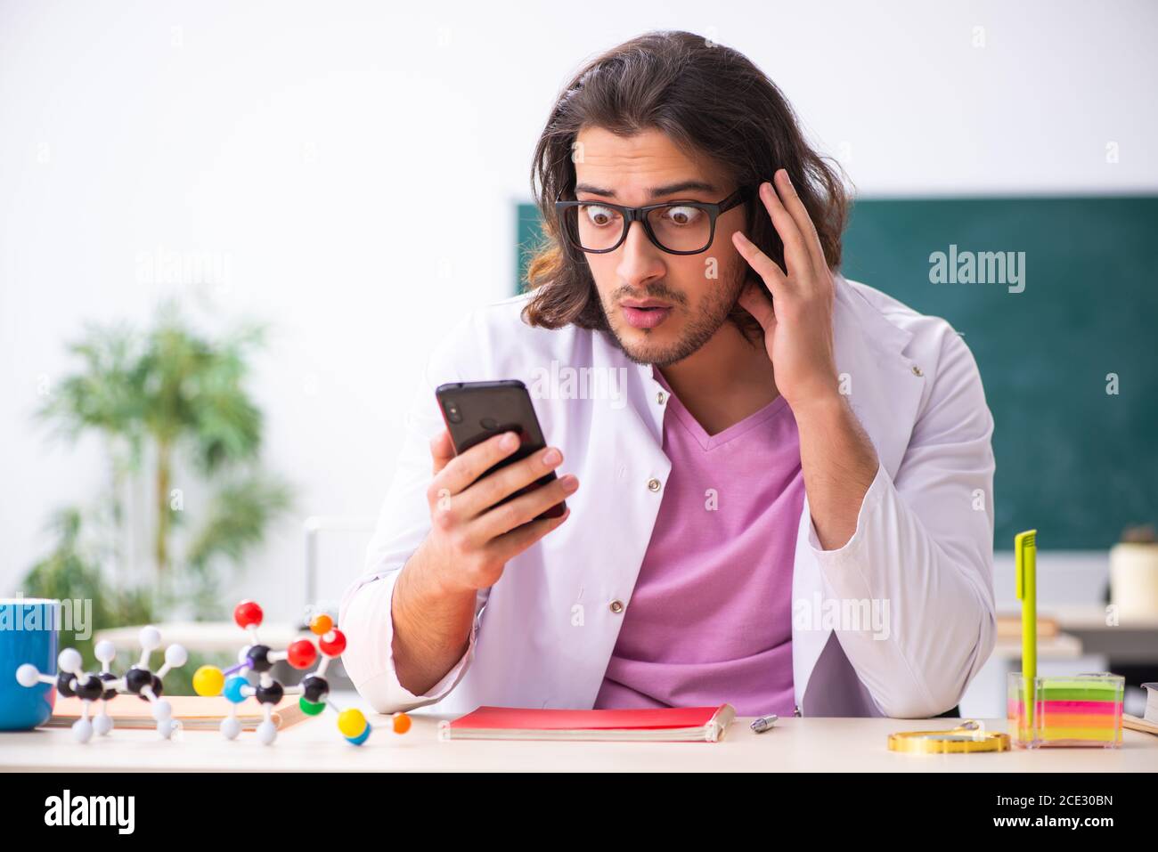 Young physicist in the classroom Stock Photo - Alamy