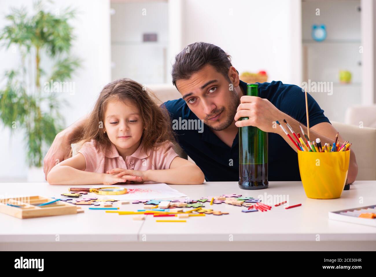 Drunk father and little girl at home Stock Photo - Alamy