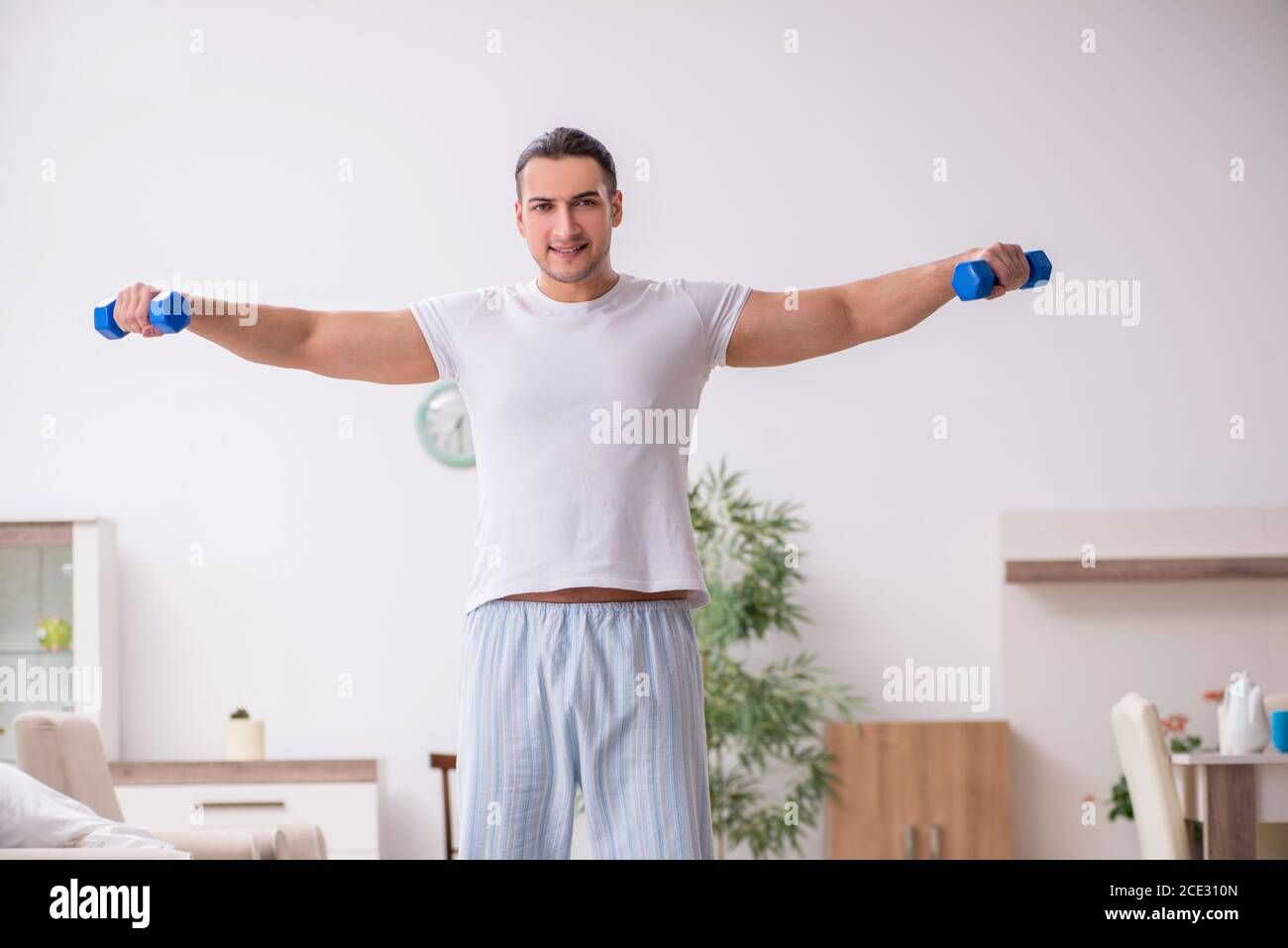Man starting day with morning exercises Stock Photo - Alamy