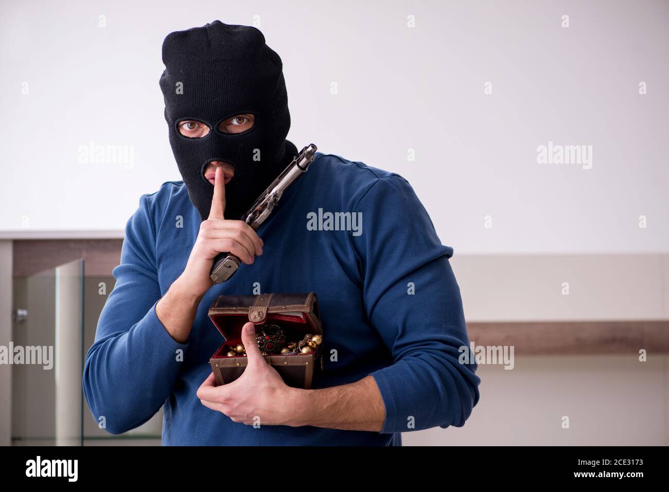 Robber stealing valuable things from the house Stock Photo - Alamy