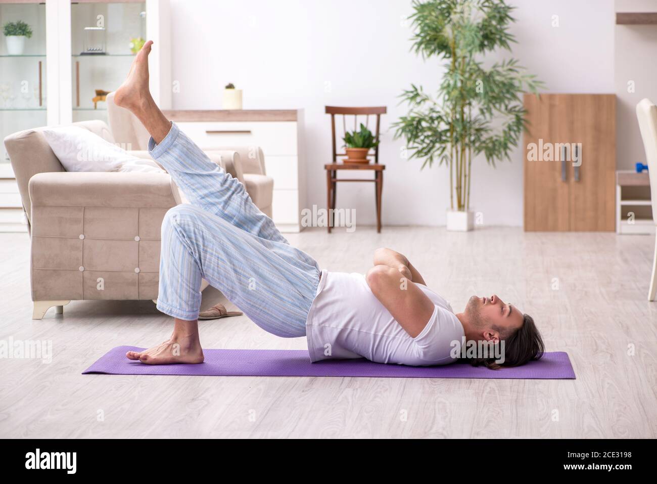 Man starting day with morning exercises Stock Photo - Alamy
