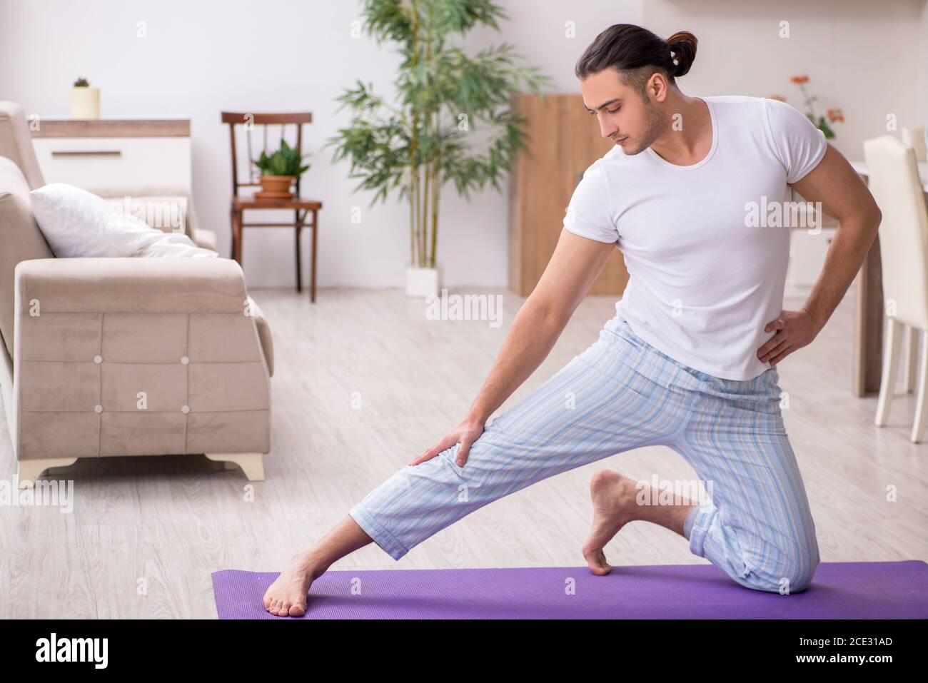 Man starting day with morning exercises Stock Photo - Alamy