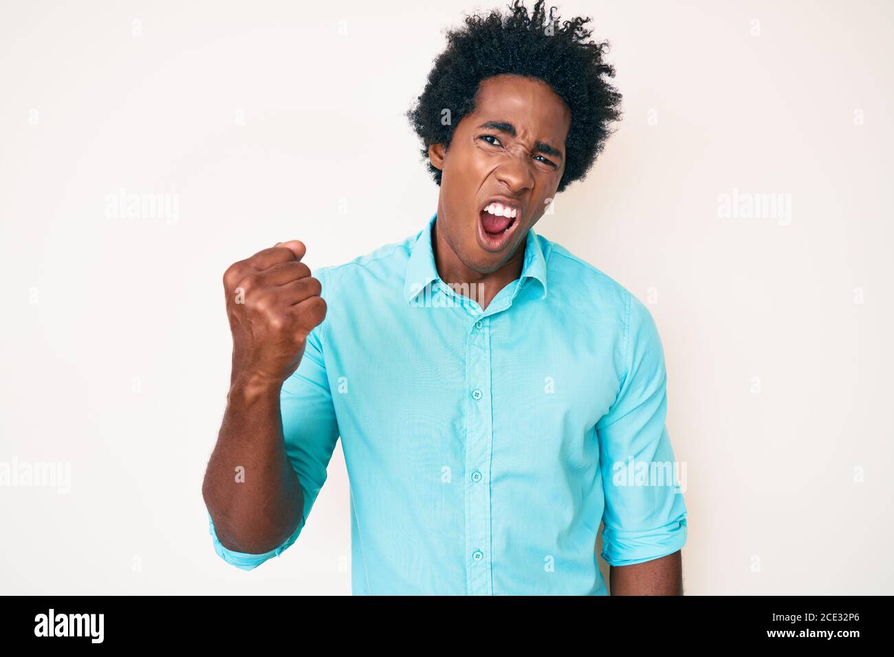 Handsome african american man with afro hair wearing casual clothes ...