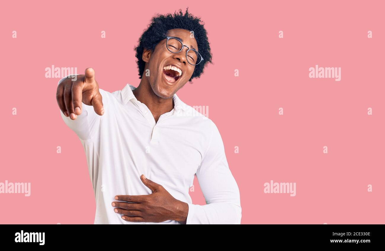 Handsome african american man with afro hair wearing casual clothes and ...