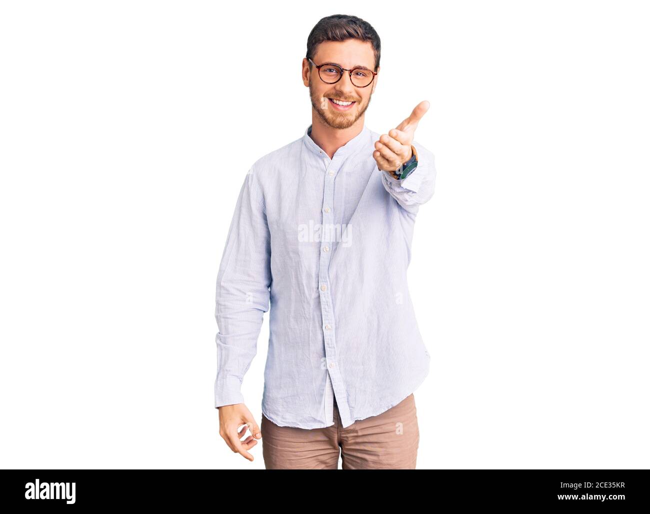 Handsome young man with bear wearing elegant business shirt and glasses ...