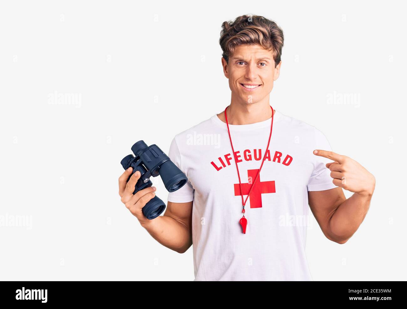 Young handsome man wearing lifeguard t-shirt using binoculars pointing ...