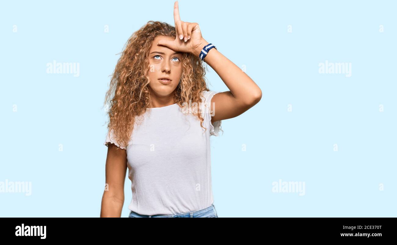 Beautiful caucasian teenager girl wearing casual white tshirt making ...