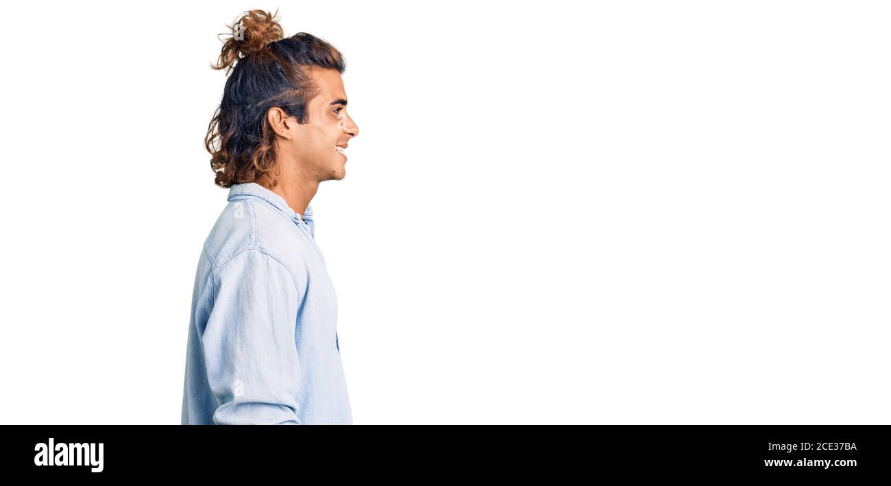 Young hispanic man wearing summer style looking to side, relax profile ...