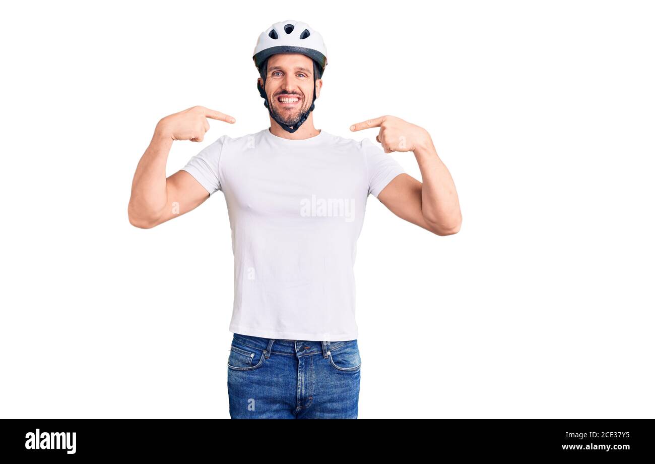 Young Handsome Man Wearing Bike Helmet Looking Confident With Smile On