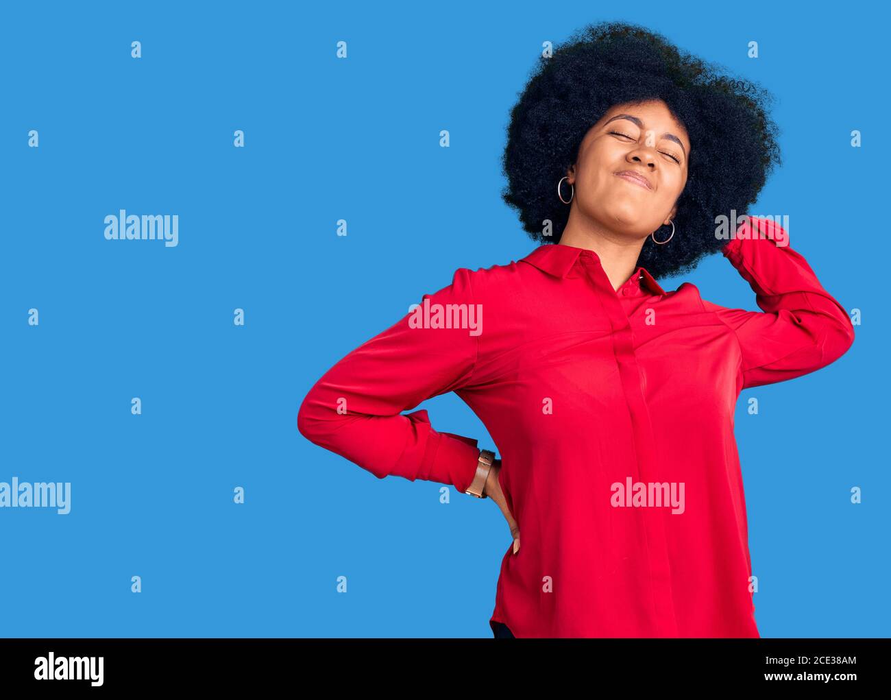 Young african american girl wearing casual clothes suffering of neck ...