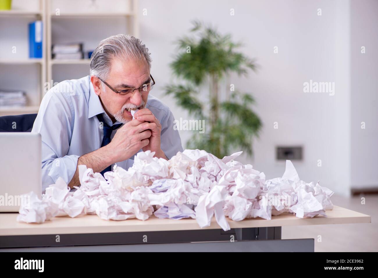 Old businessman rejecting ideas with lots of papers Stock Photo - Alamy
