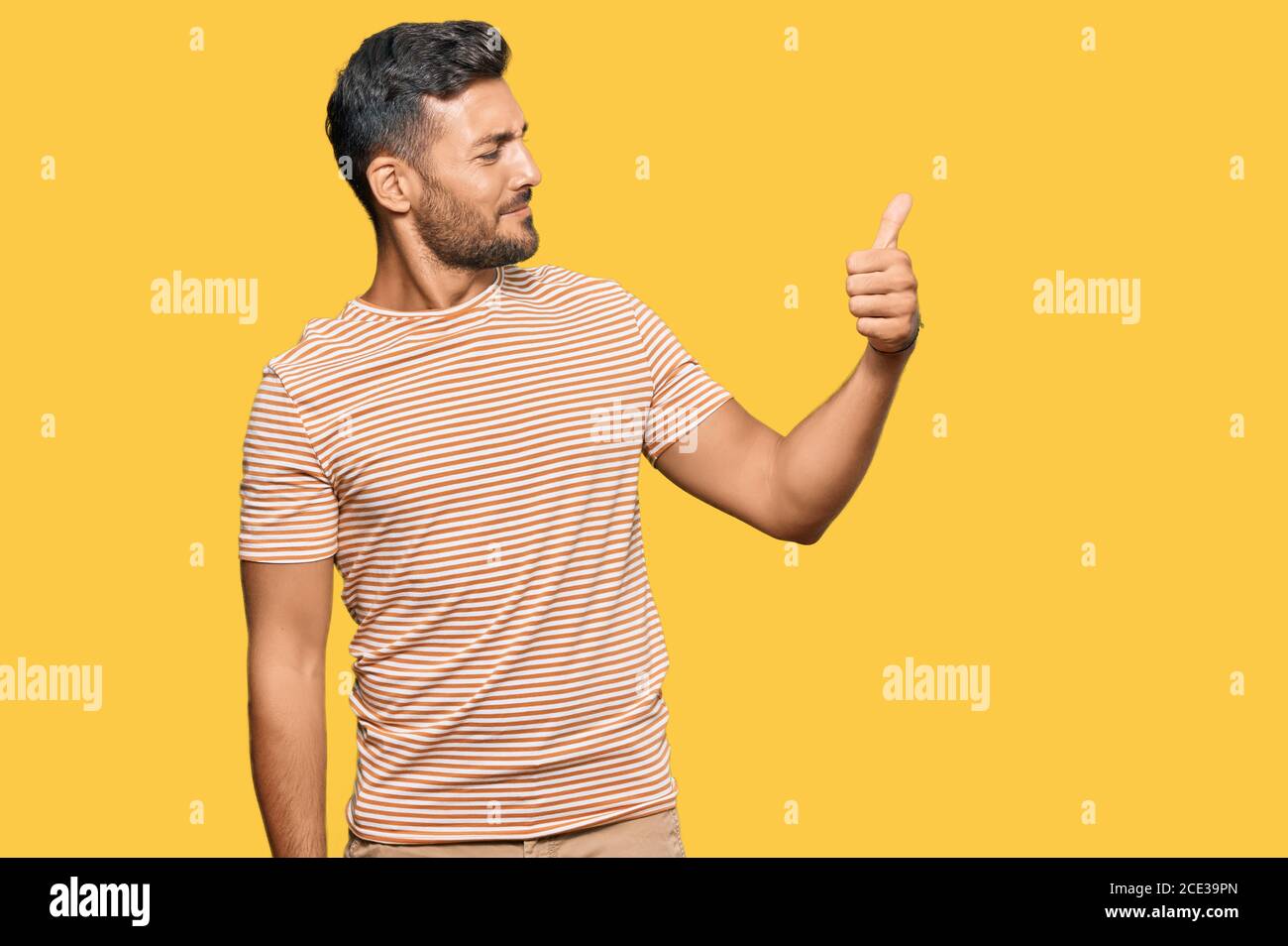 Handsome hispanic man wearing casual clothes looking proud, smiling ...