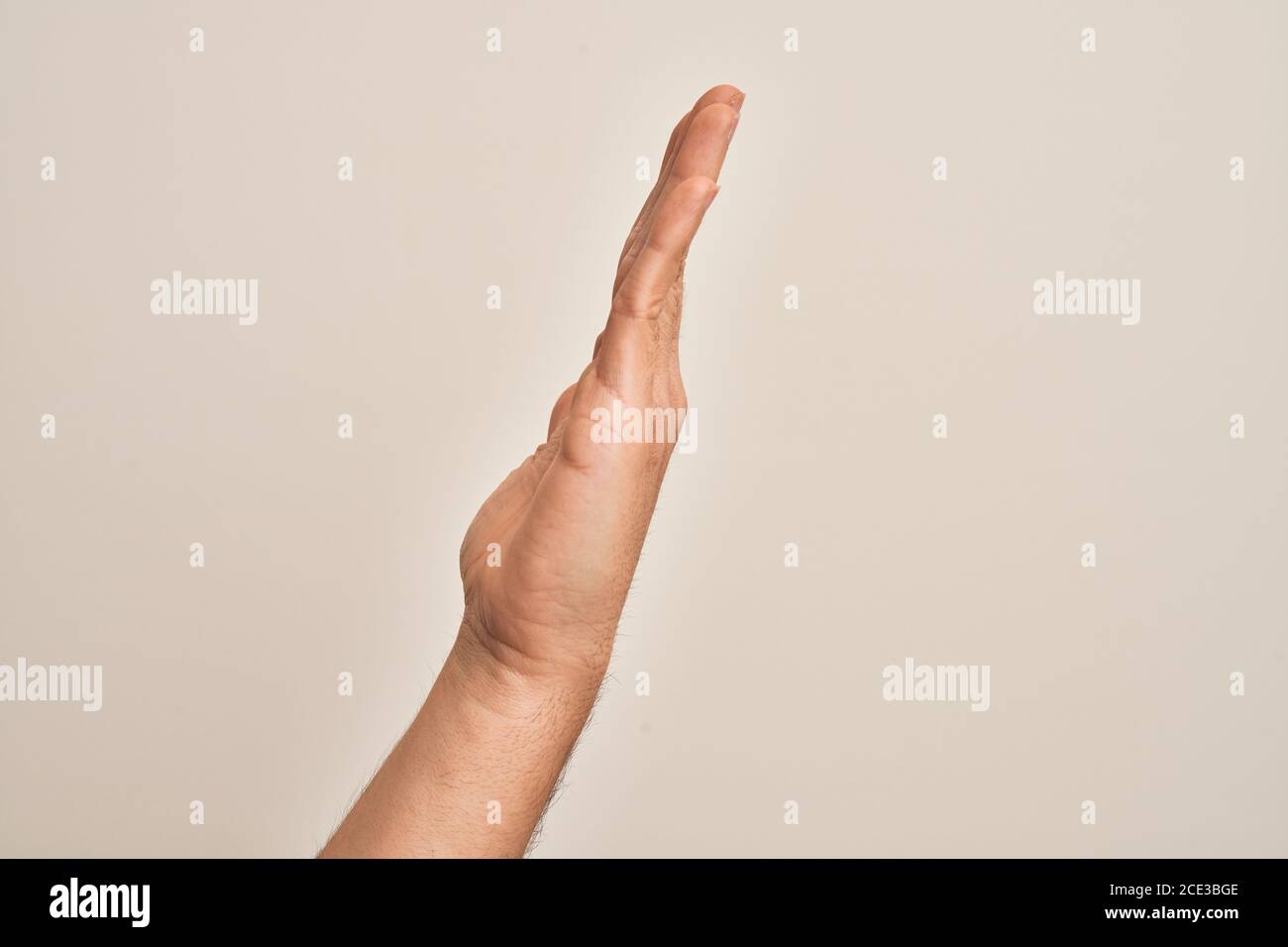 Hand of caucasian young man showing fingers over isolated white ...