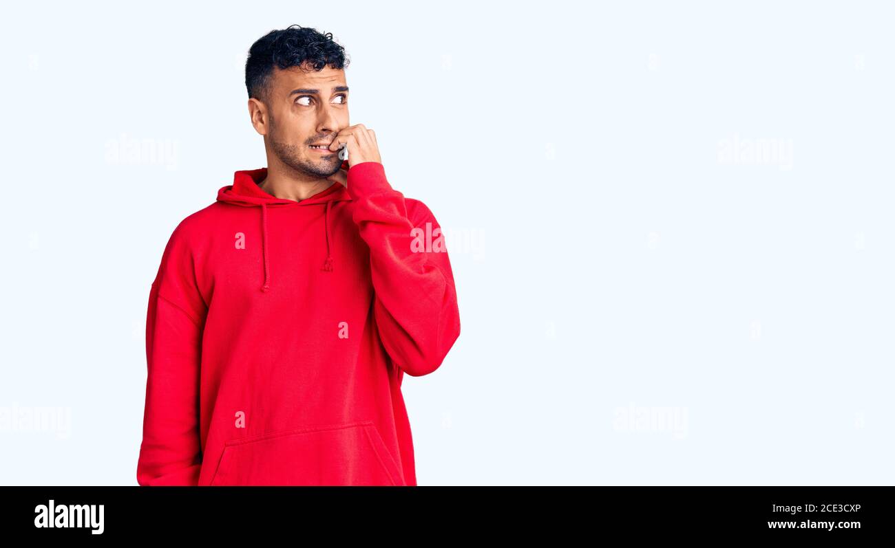 Young hispanic man wearing casual clothes looking stressed and nervous ...