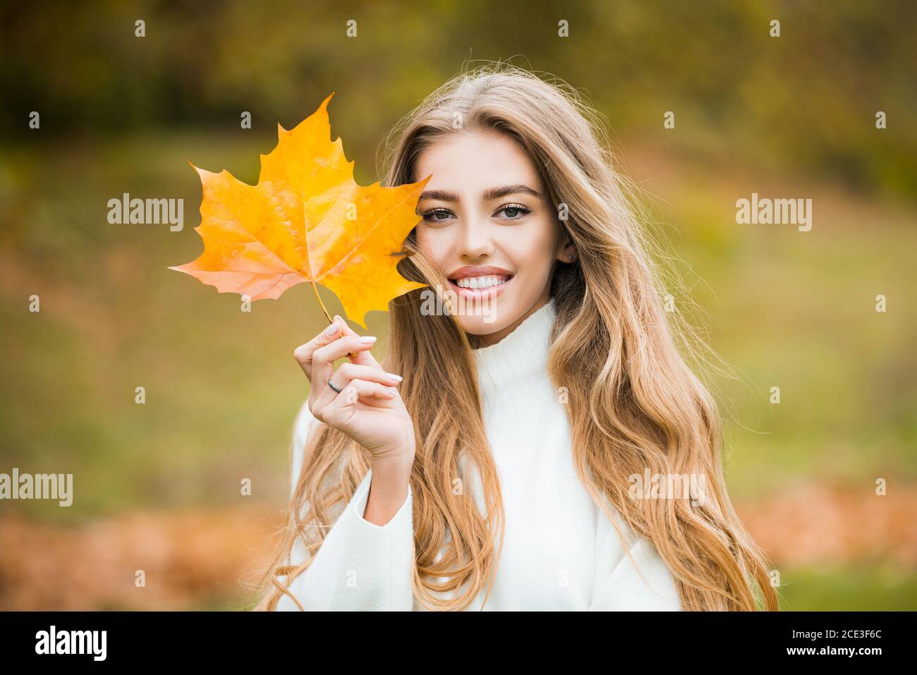 Happy autumn woman having fun with leaves outdoor in park. Happiness carefree Stock Photo - Alamy