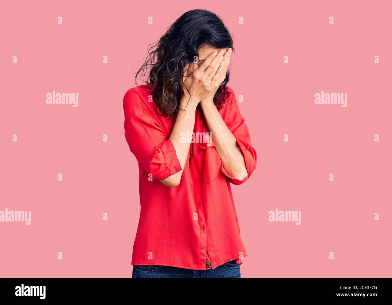Young beautiful hispanic woman wearing casual clothes with sad ...