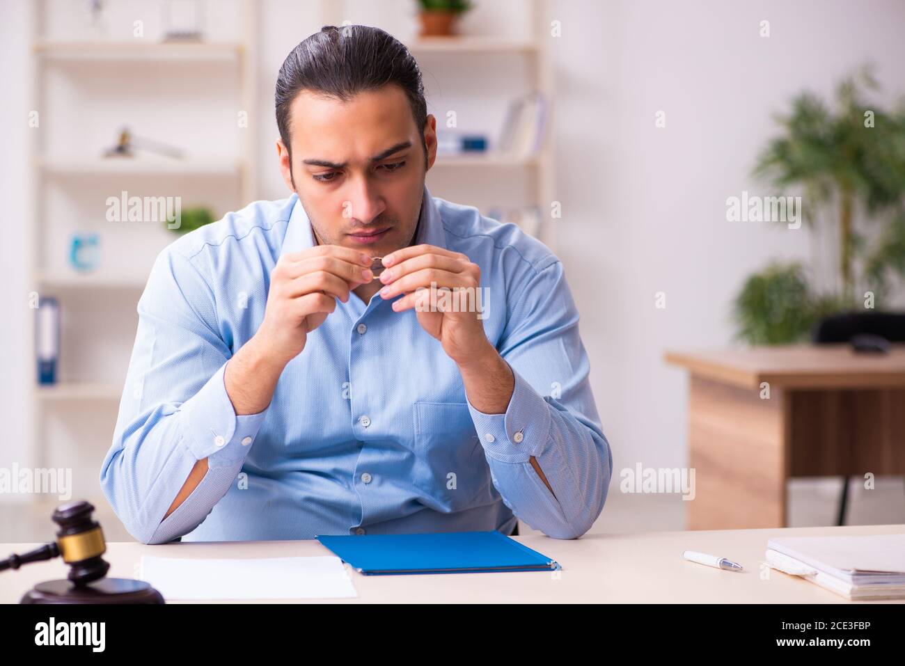 Young man in the courthouse in divorcing concept Stock Photo - Alamy