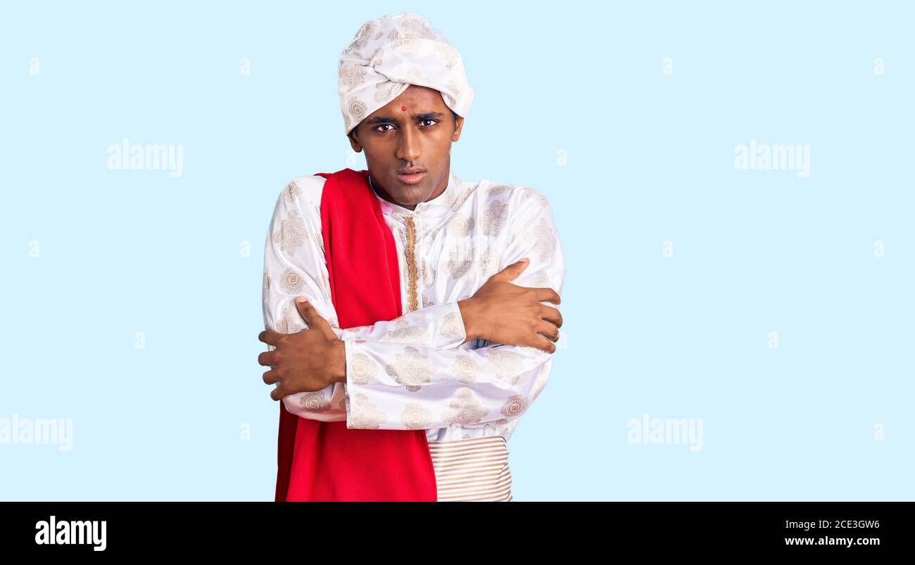 African handsome man wearing tradition sherwani saree clothes shaking ...