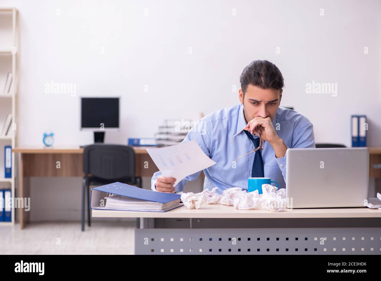 Sick male employee suffering at the workplace Stock Photo - Alamy