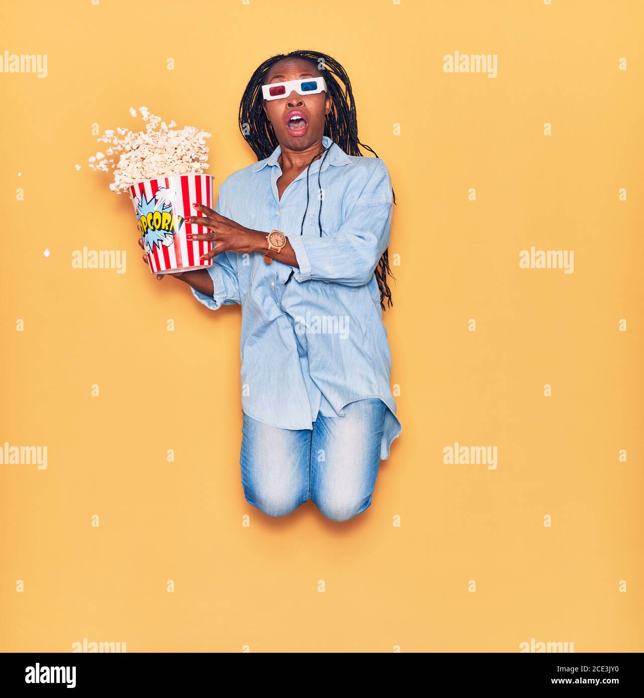 Young beautiful african american woman surprised with open mouth ...