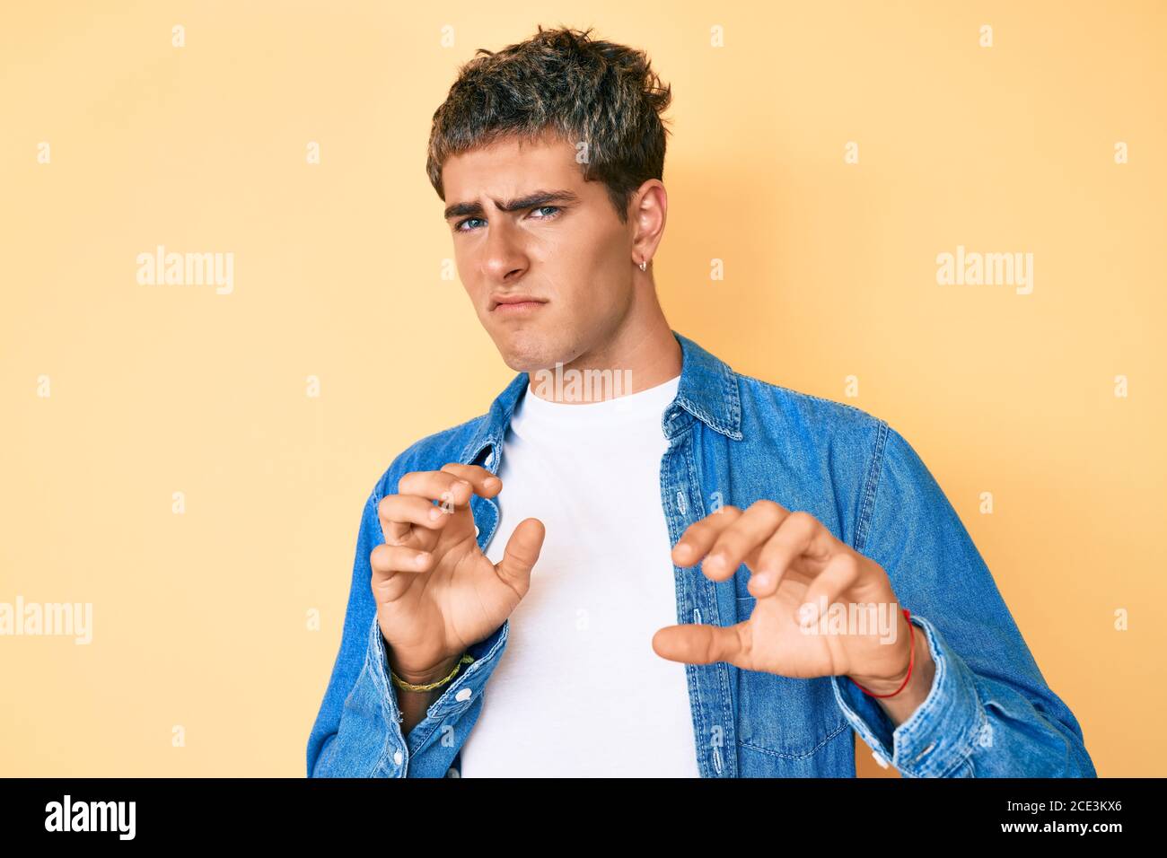 Young handsome man wearing casual clothes disgusted expression ...