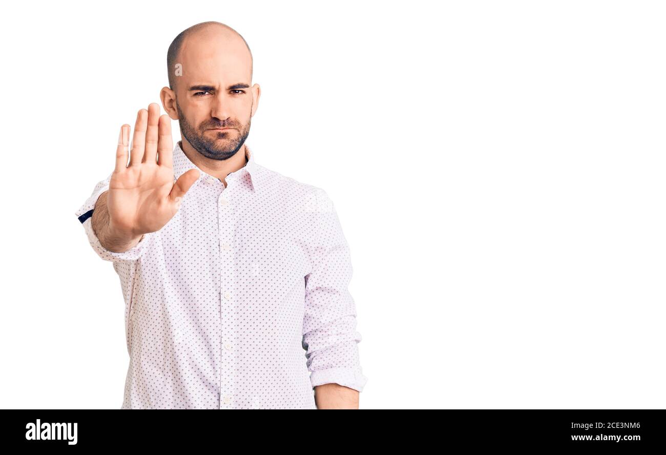 Young handsome man wearing elegant shirt doing stop sing with palm of ...