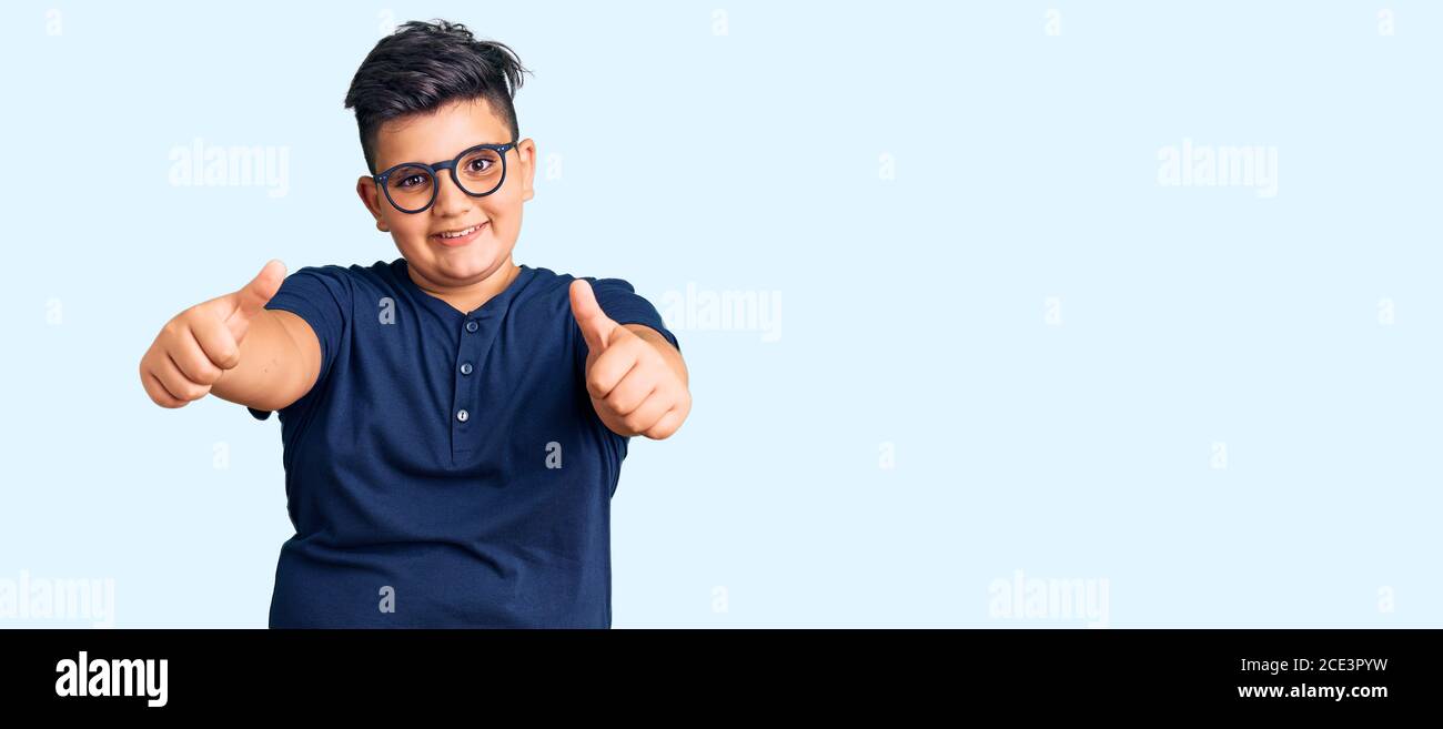 Little boy kid wearing casual clothes and glasses approving doing ...