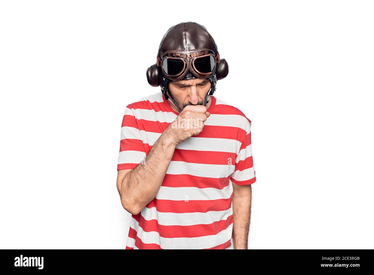 Middle age aviator man wearing vintage helmet and glasses over isolated ...