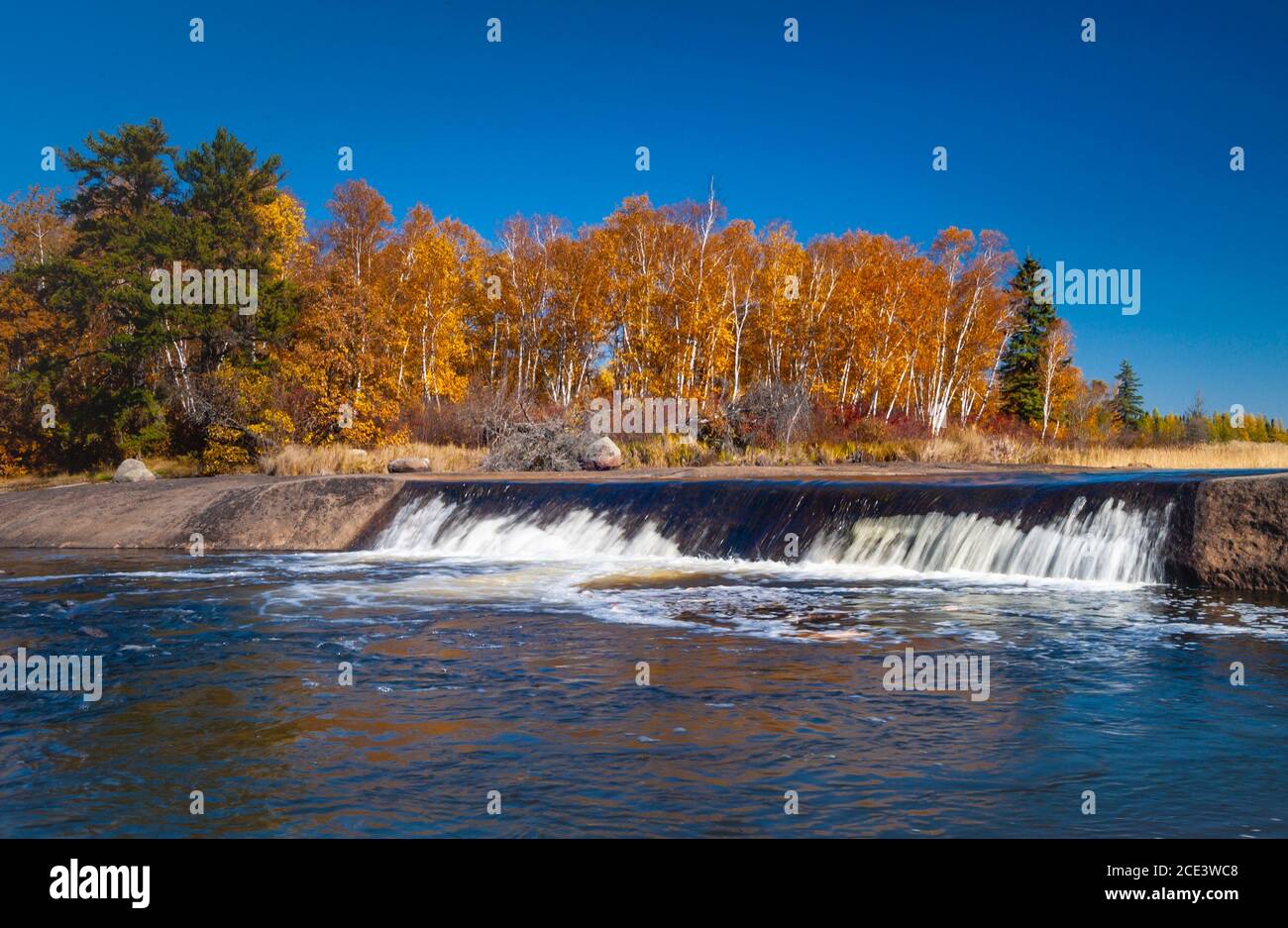 Rainbow Falls with fall foliage color in the Whiteshell Provincial Park ...