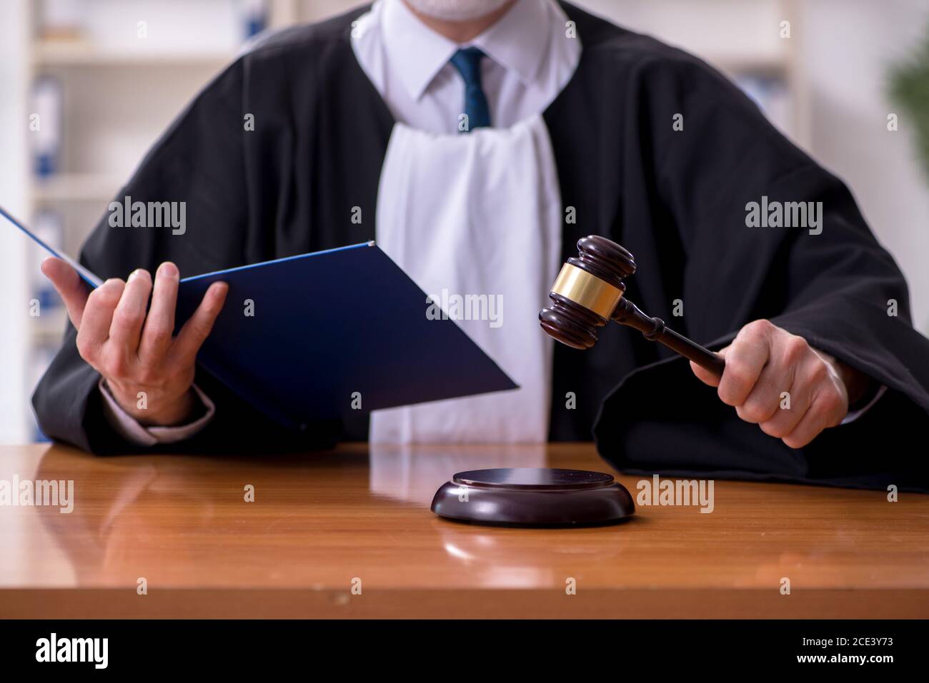 Old judge working in courthouse Stock Photo - Alamy